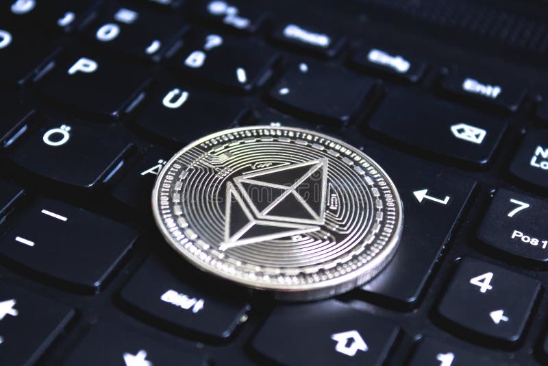 Large Coin Placed on Top of a Black Computer Keyboard Stock Image ...