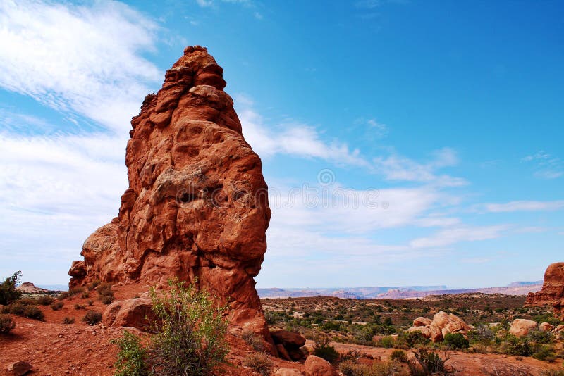 Large Column of Rock Standing Over an Open Plain in Utah Stock Photo ...