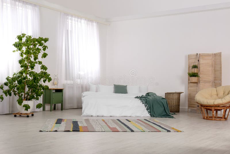 Large Comfortable Bed in Stylish Room. Modern Interior Stock Photo ...