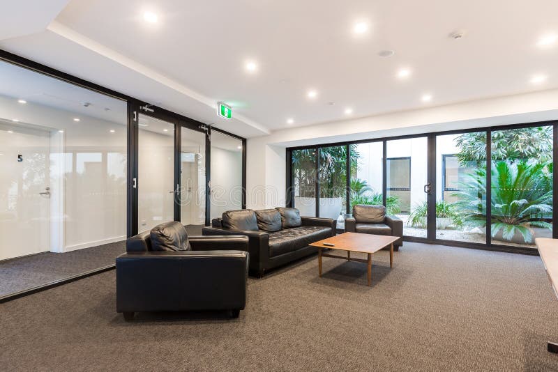 A Large Common Room Inside a Modern Residence Stock Photo - Image of ...