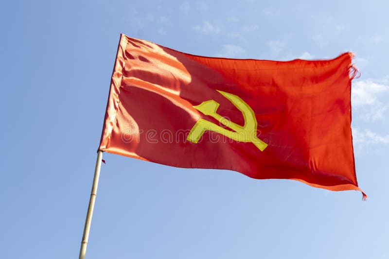 Large Communist Flag Floating in the Wind with a Blue Sky Stock Photo ...
