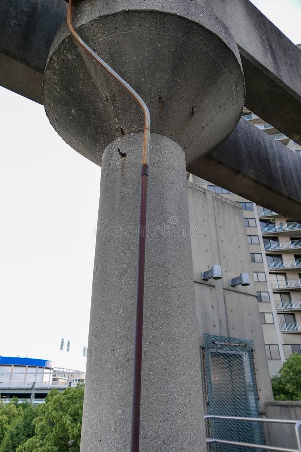 Large Concrete Column with a Rusty Pipe Stock Image - Image of concrete ...