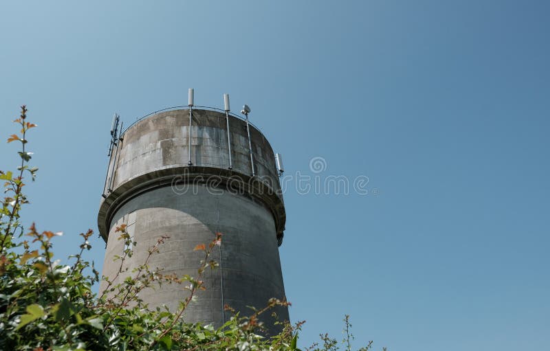 Large, Concrete Water Tower with Telecom and Wireless 4G Antennas ...