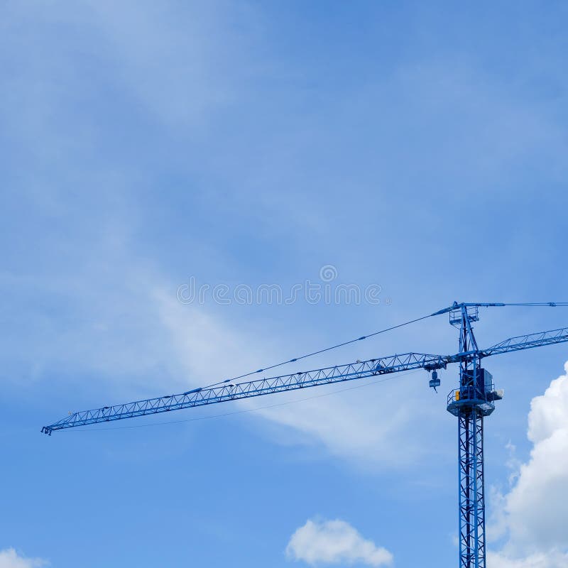 Large Construction Crane Machine with Clear Blue Sky Stock Photo ...