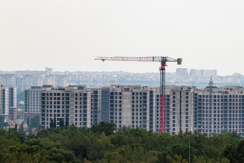 Large Construction Crane Working for Public Housing Construction on a ...