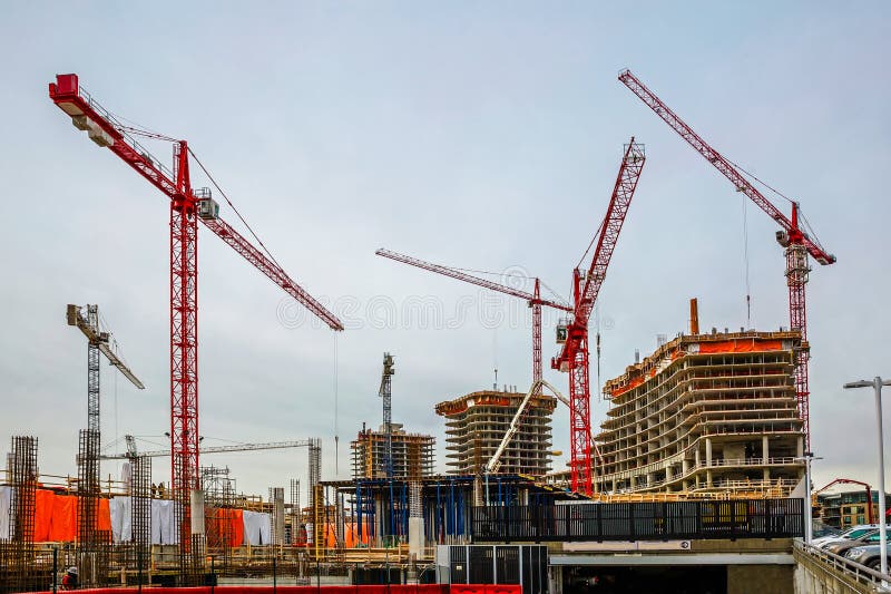 Construction Site with Cranes on the Background of Gray Sky Stock Image ...