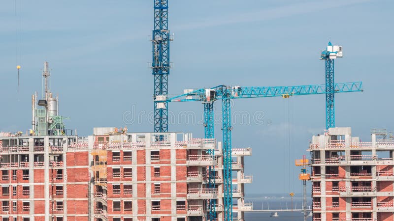 Large Construction Site Including Several Cranes Working on a Building ...