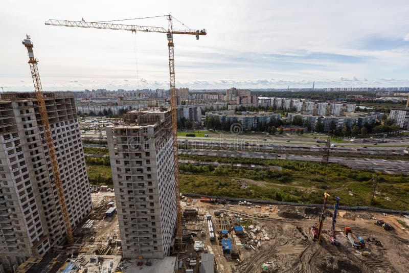 Large Construction Site Including Several Cranes Working on a Building ...