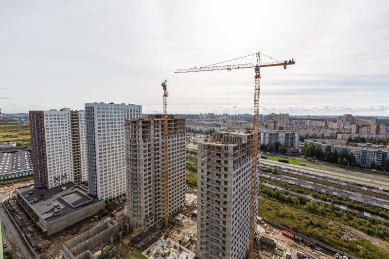 Large Construction Site Including Several Cranes Working on a Building ...