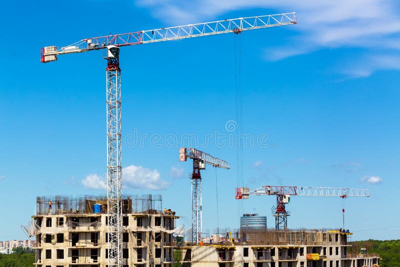 Large Construction Site Including Several Cranes Working on a Building ...