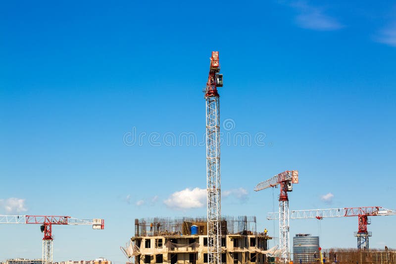 Large Construction Site Including Several Cranes Working on a Building ...