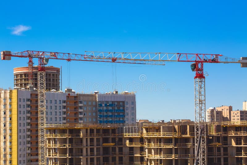 Large Construction Site Including Several Cranes Working on a Building ...