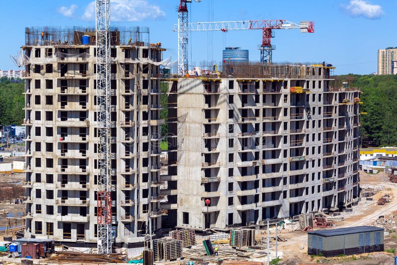 Large Construction Site Including Several Cranes Working on a Building ...