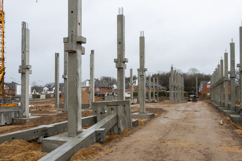 A Large Construction Site Many Concrete Columns are Placed with the ...
