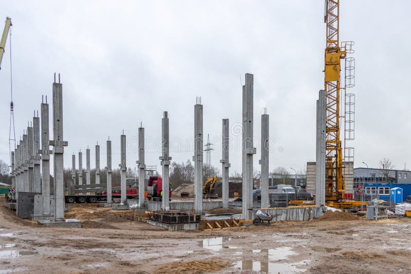 A Large Construction Site Many Concrete Columns are Placed with the ...