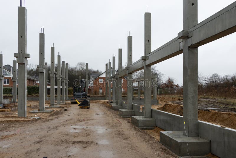 A Large Construction Site Many Concrete Columns are Placed with the ...