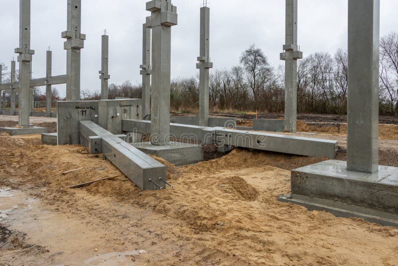 A Large Construction Site Many Concrete Columns are Placed with the ...