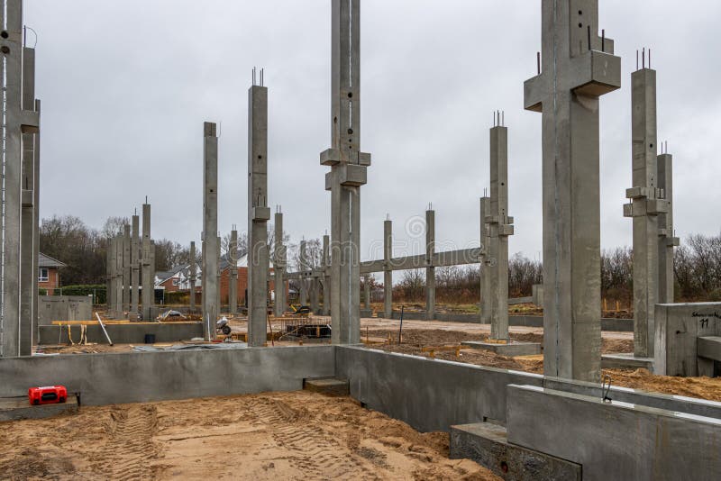 A Large Construction Site Many Concrete Columns are Placed with the ...