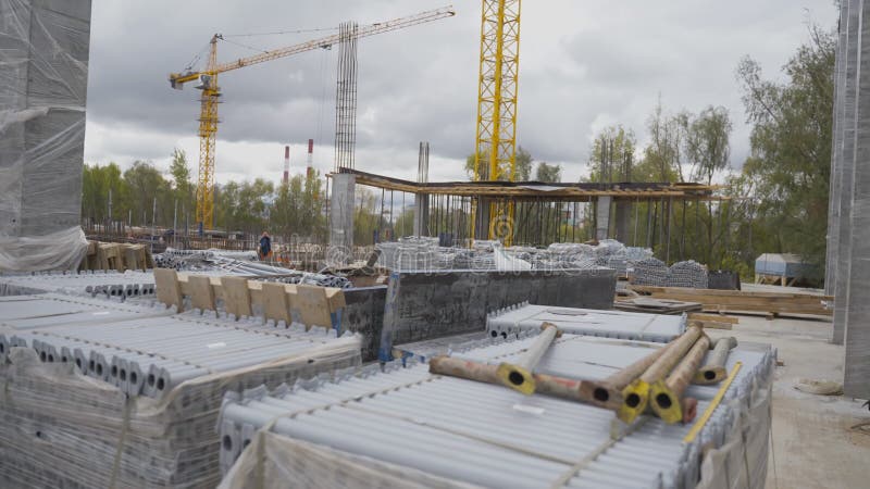 Construction Site with Tower Cranes Over Stacks of Materials Stock ...