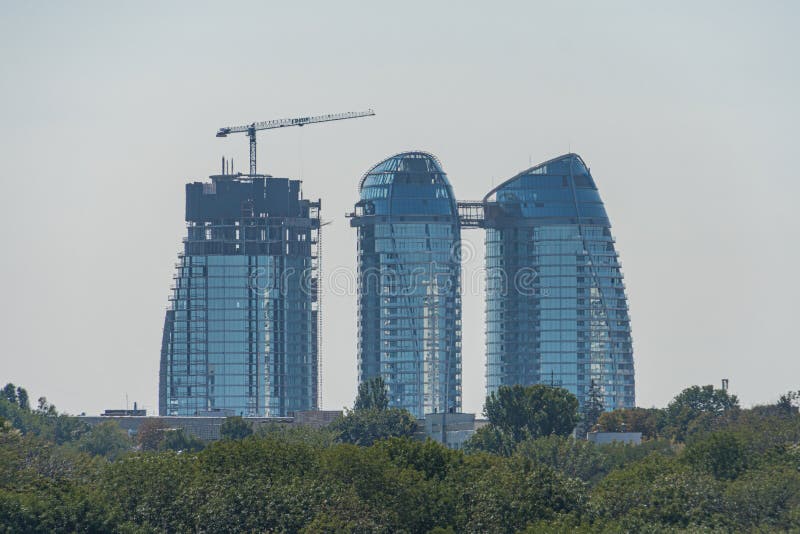 A Large Construction Site with Two Under-construction Buildings, One ...