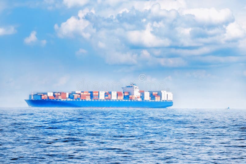 Large Container Cargo Ship in the Ocean, Side View Stock Photo - Image ...
