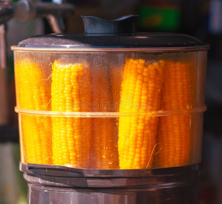 A Large Container of Corn is Sitting on a Counter Stock Image - Image ...