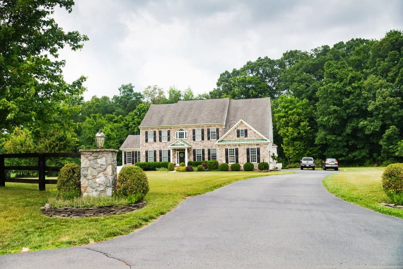 Large Country Home with Large Green Lawn in Front Yard. and Woods in ...