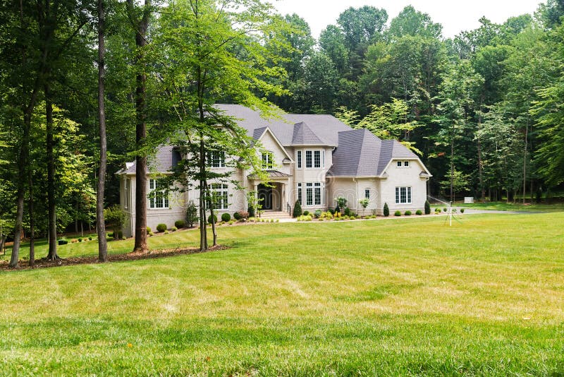 Large Country Home with Large Green Lawn in Front Yard. and Woods in ...