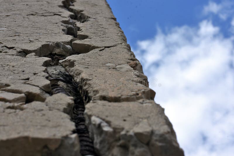 A Large Crack in a Concrete Column Against a Blue Sky. Stock Image ...