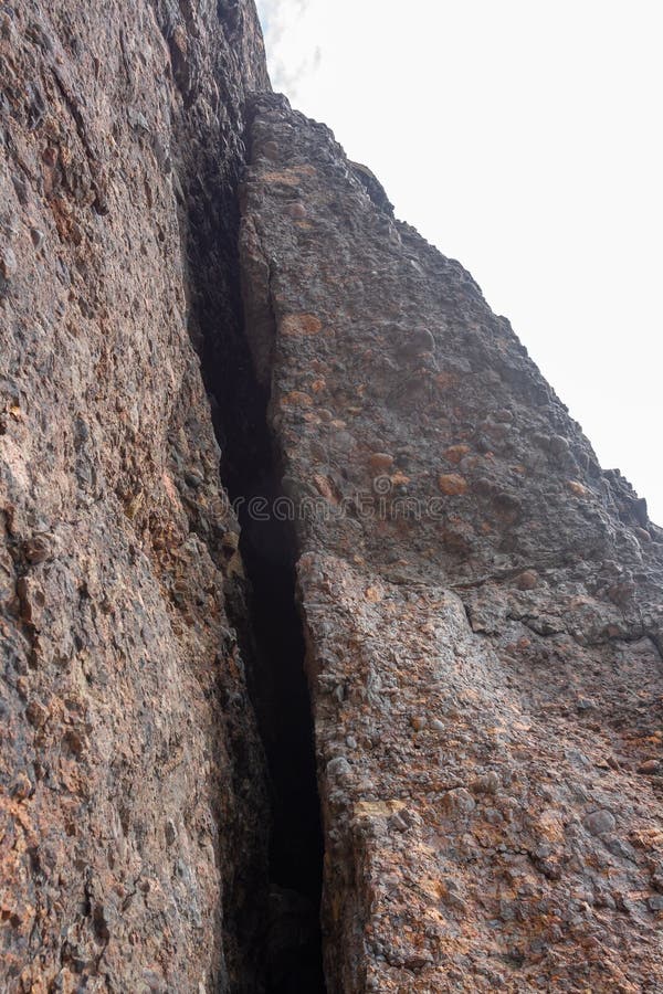 Large Crack in the Rock Consisting of Small Round Stones Held Together ...