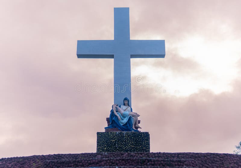 Large Cross Monument with Religious Statue at Sunset Stock Photo ...