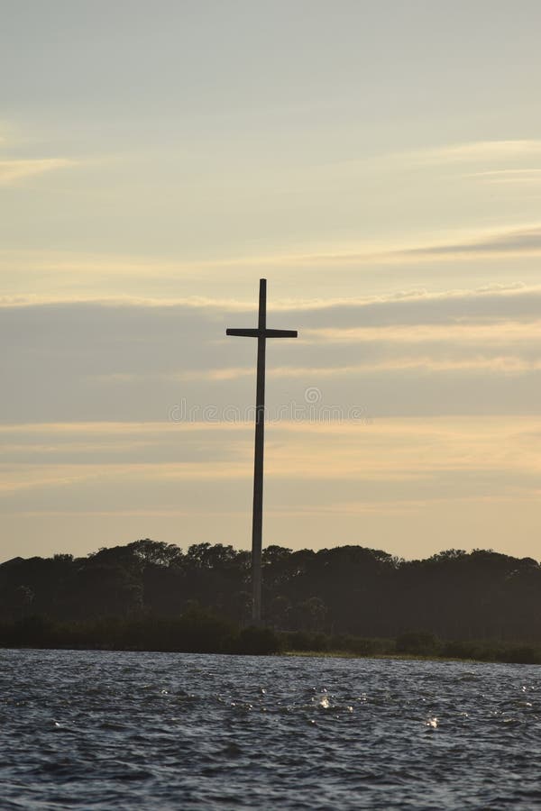 Large Cross by the River stock photo. Image of dusk, ocean - 98745214