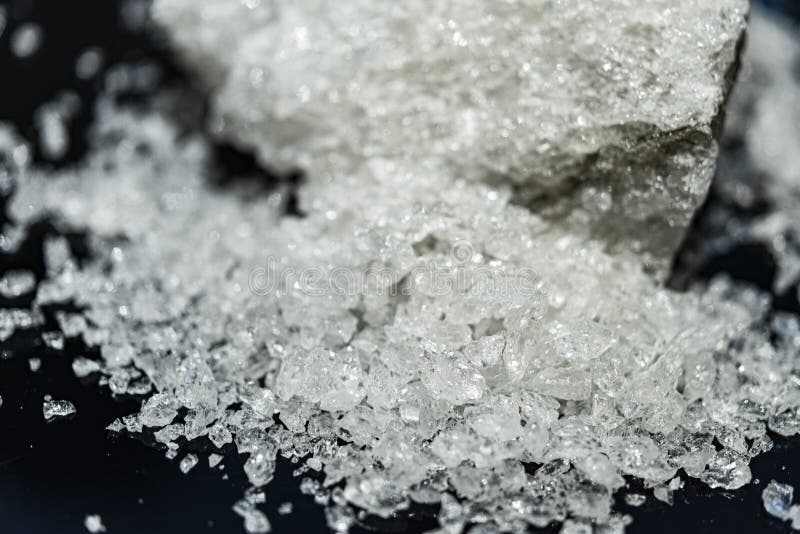 Large Crystal of Salt on Black Reflective Surface; Selective Focus ...
