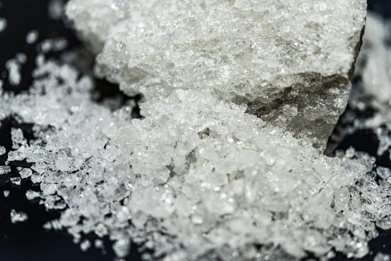 Large Crystal of Salt on Black Reflective Surface; Selective Focus ...