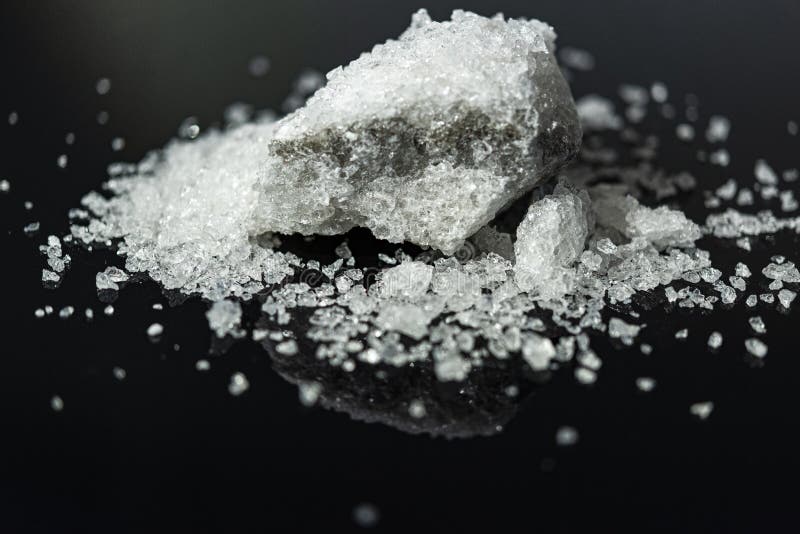 Large Crystal of Salt on Black Reflective Surface; Selective Focus ...