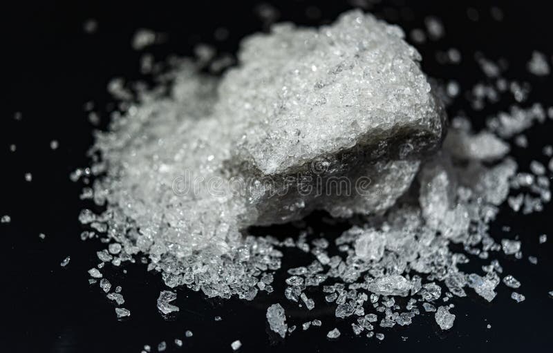 Large Crystal of Salt on Black Reflective Surface; Selective Focus ...