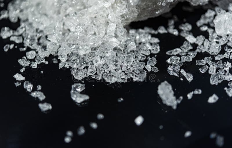 Large Crystal of Salt on Black Reflective Surface; Selective Focus ...