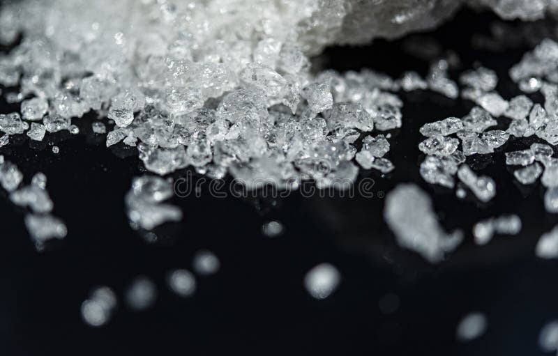 Large Crystal of Salt on Black Reflective Surface; Selective Focus ...