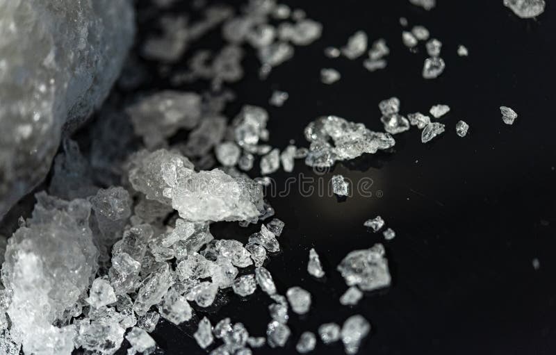 Large Crystal of Salt on Black Reflective Surface; Selective Focus ...