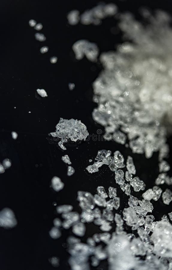 Large Crystal of Salt on Black Reflective Surface; Selective Focus ...