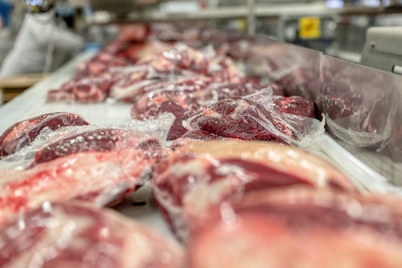 Large Cuts of Beef Packed in a Vacuum Plastic Bag. Stock Photo - Image ...