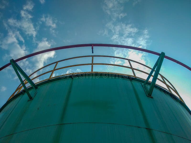 A Large, Cylindrical Green Storage Tank is Viewed from Below Stock ...