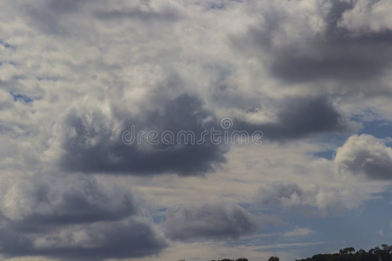 Large Dark Cumulus Clouds in the Blue Sky Stock Photo - Image of ...