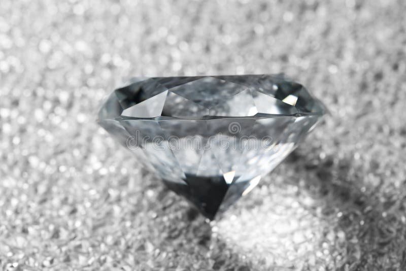 Large Dazzling Brilliant on Shiny Silver Surface, Top View Stock Photo ...
