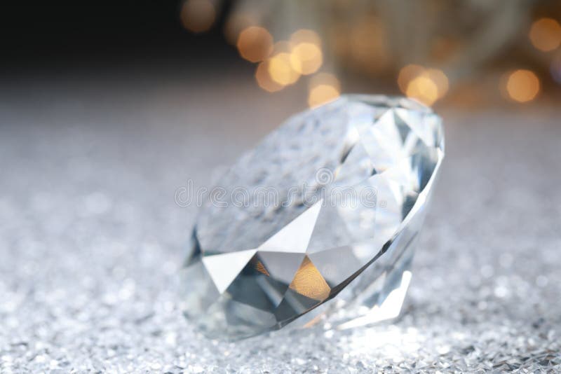 Large Dazzling Brilliant on Shiny Surface Against Blurred Festive ...