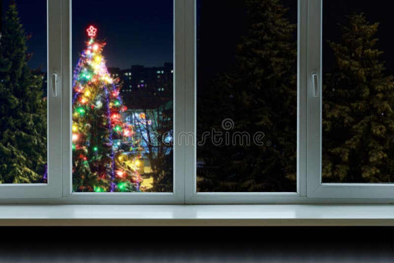 A Large Decorated Christmas Tree Outside the Window Stock Image - Image ...