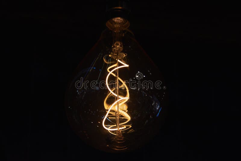 Large Decorative Incandescent Lamp on a Dark Background. Numerous Light ...