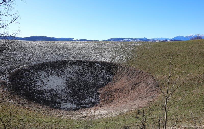 Large Depression in the Terrain with Snow in the Mountains Caused by ...
