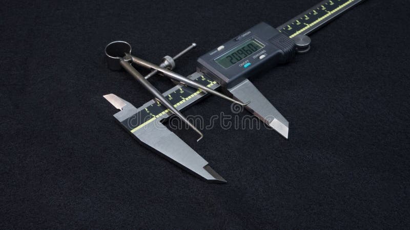 Large Digital Calipers VS Old Spring Calipers on Black Felt Stock Image ...
