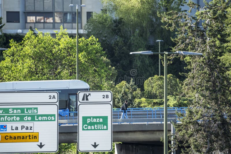 Large Directional Indicator Signs on the Road and a Pedestrian ...